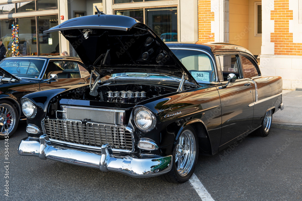 Black retro Chevrolet Bel Air with open car hood. 1955 Chevy at car ...
