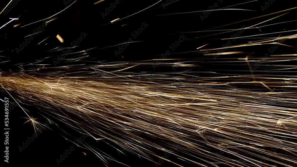 Bright sparks on a black background. Sparks of fire fly and fall. Cut ...