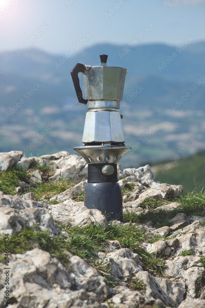 Moka, mocha pot outdoor, Italian mocha coffee in nature. Mountain peak ...