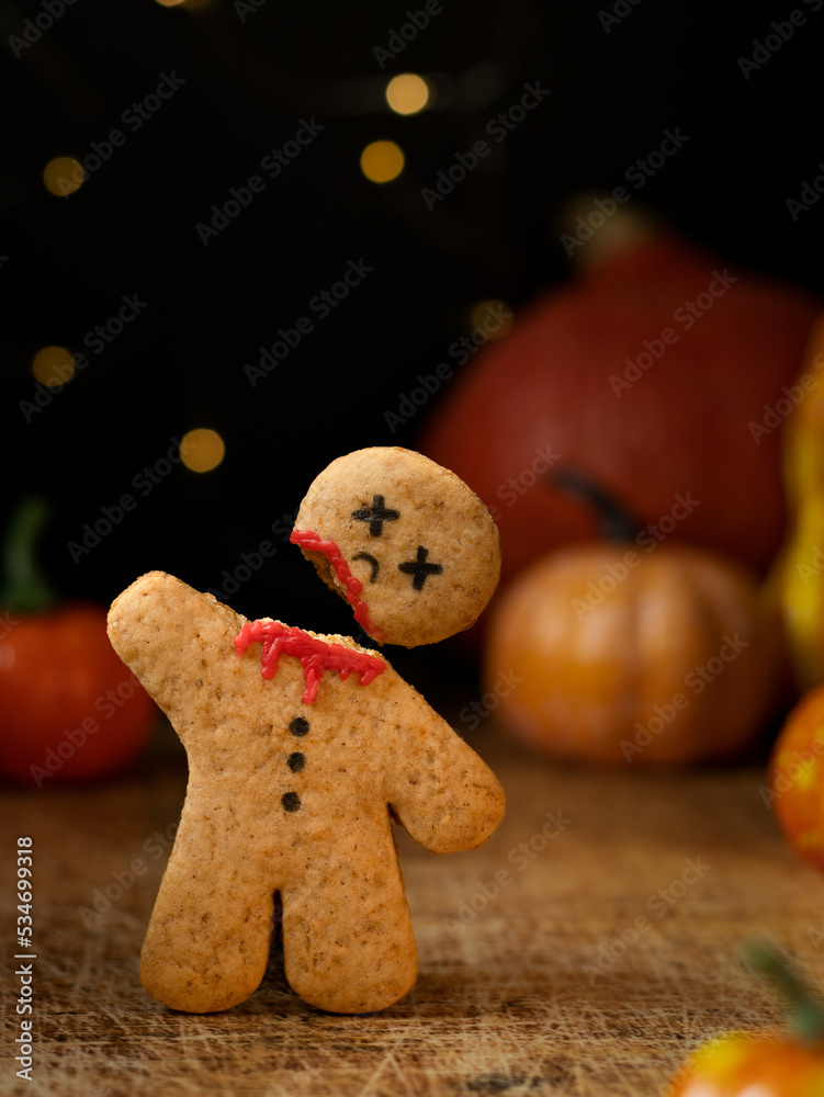 Halloween ginger cookie. Gingerbread man with severed head and blood on ...