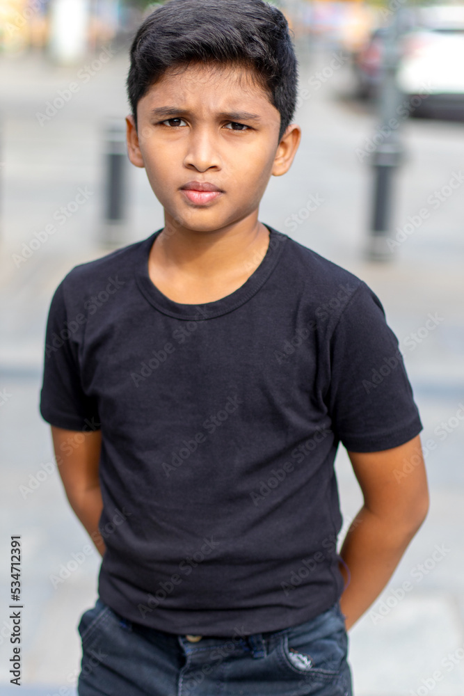 Cute Boy standing with serious look, Serious face pose, Kid with ...