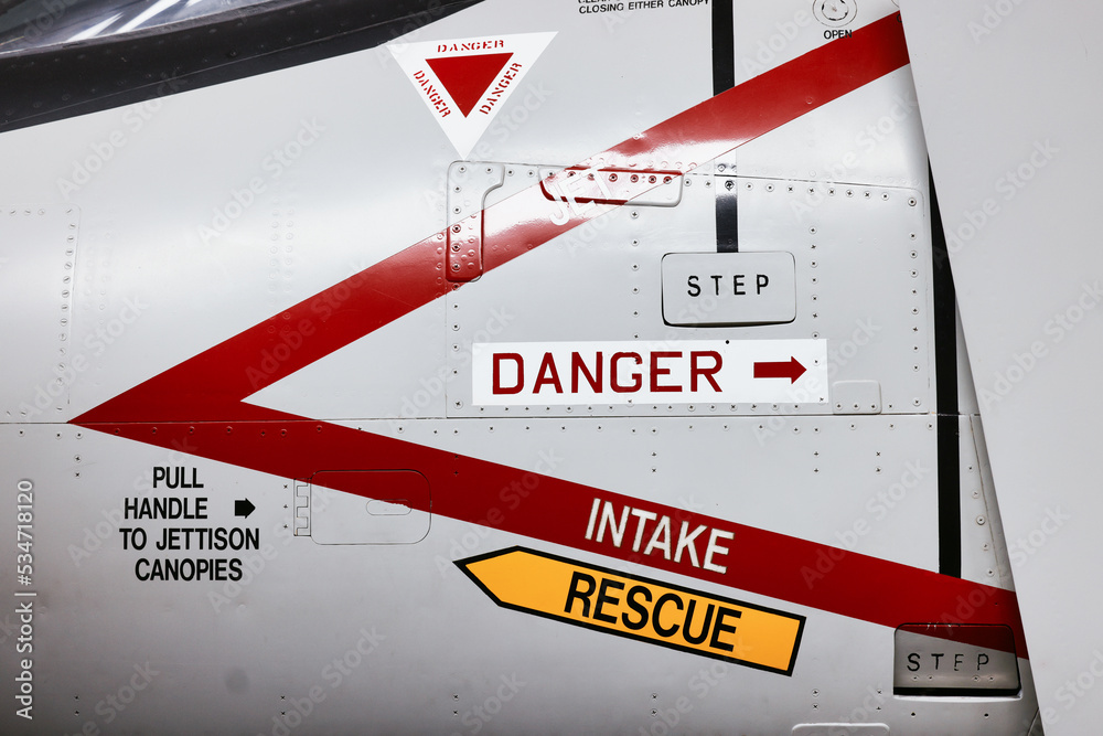 Danger aircraft jet ejector seat rescue and intake signs on side of ...