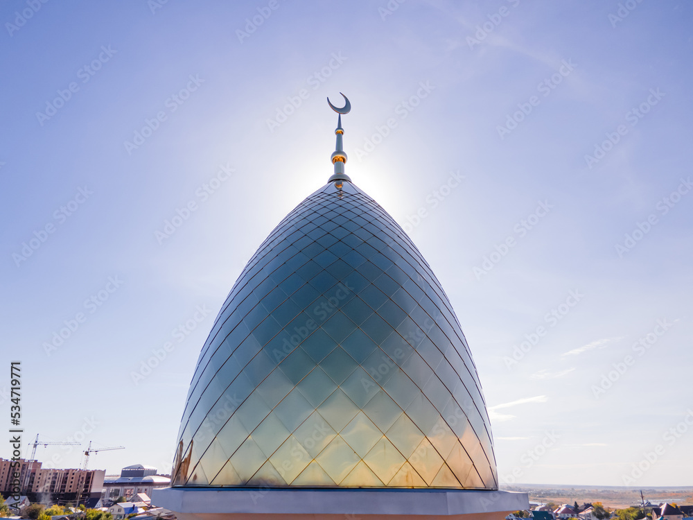 A Muslim golden dome with a crescent moon on the mosque. Minaret ...