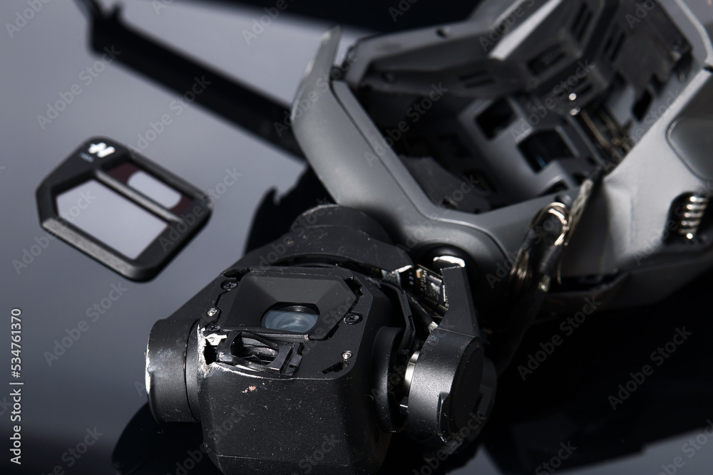 Drone DJI Mavic 3 after crashed on a black background. Drone after ...