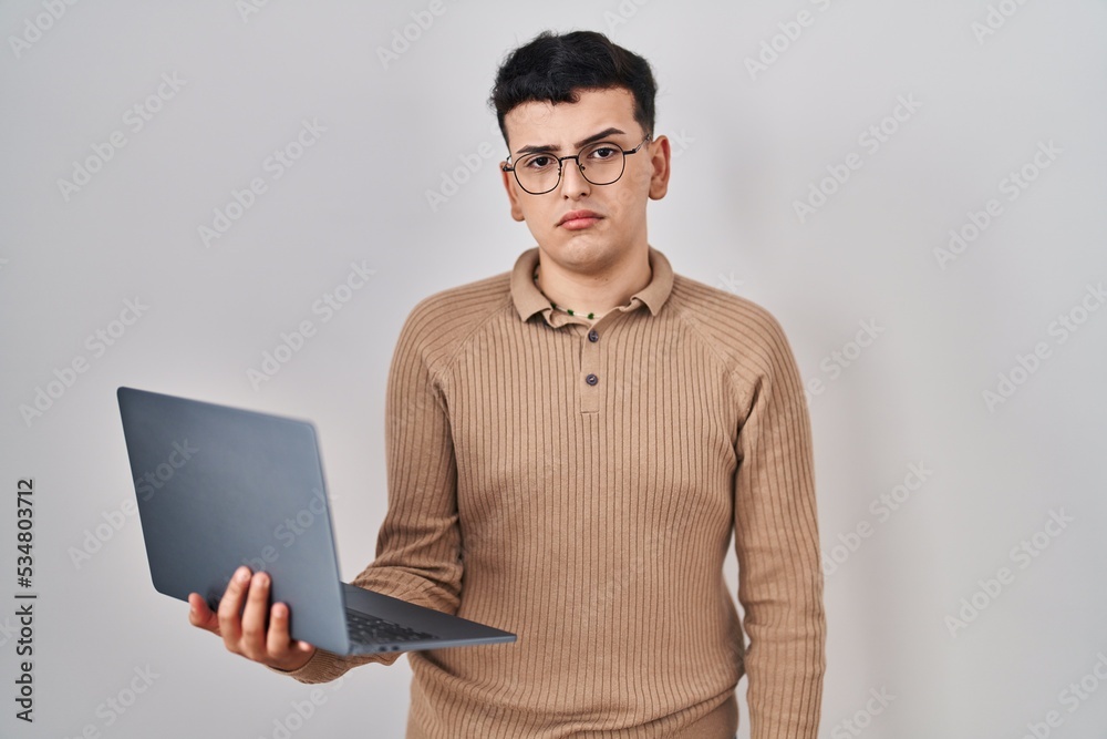 Non binary person using computer laptop depressed and worry for ...