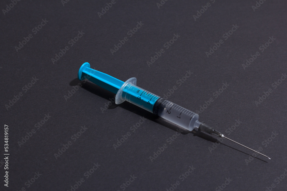 Disposable plastic syringe prepared for injection and vaccination in ...