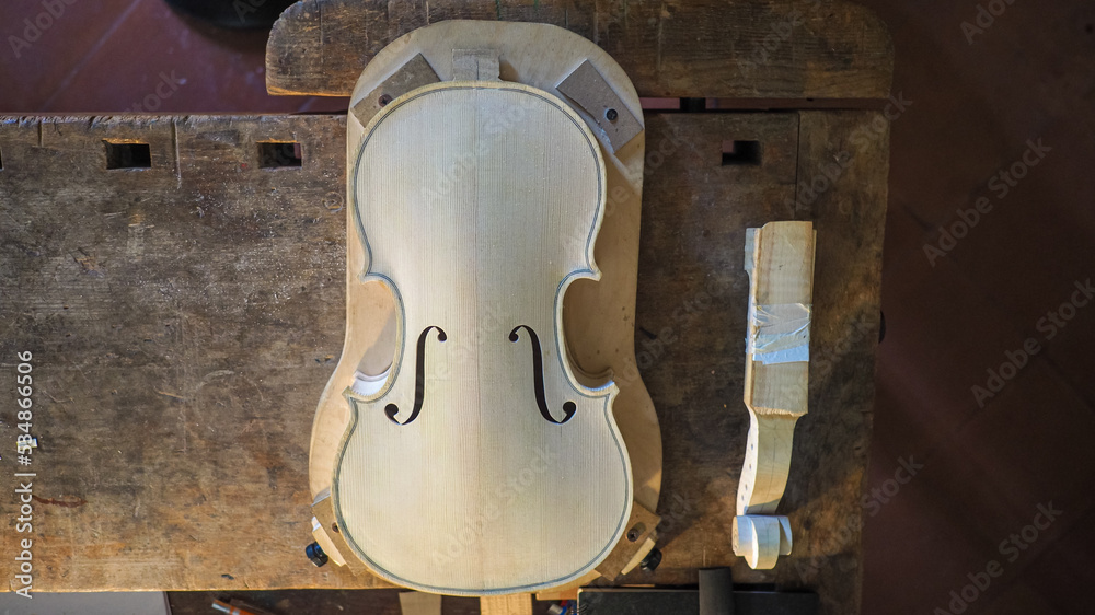 handmade blank violin ready to be varnished at luthier desk Stock Photo ...