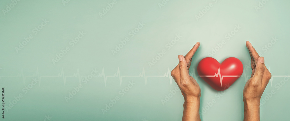 Medical red heart with cardiogram chart line in hand background ...