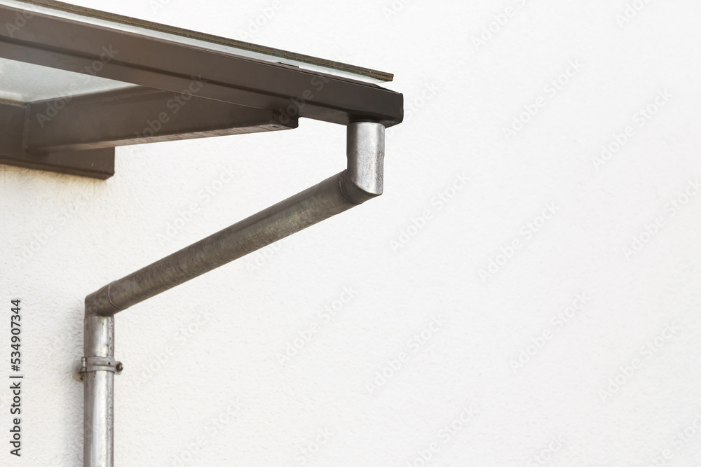 Gutter system of Roof over Front Door. Metallic Guttering Roof System ...