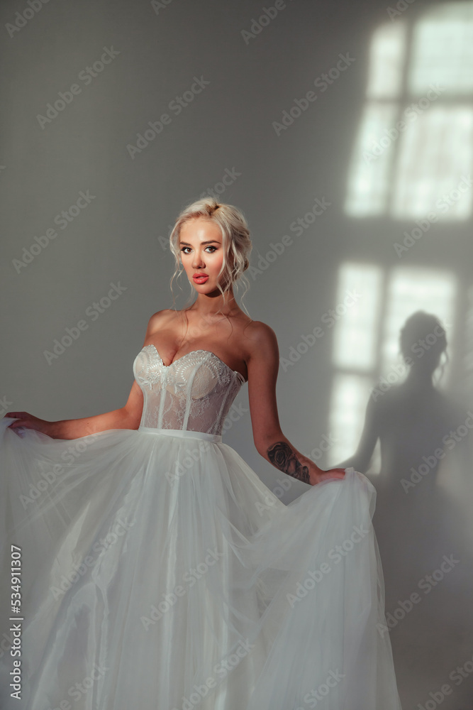 Portrait stylish french bride young woman in white wedding dress in ...