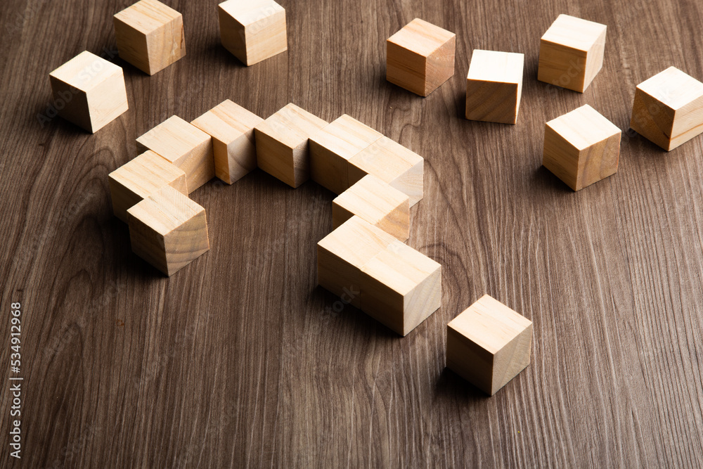 Forming bigger question mark. question mark on wooden table background ...