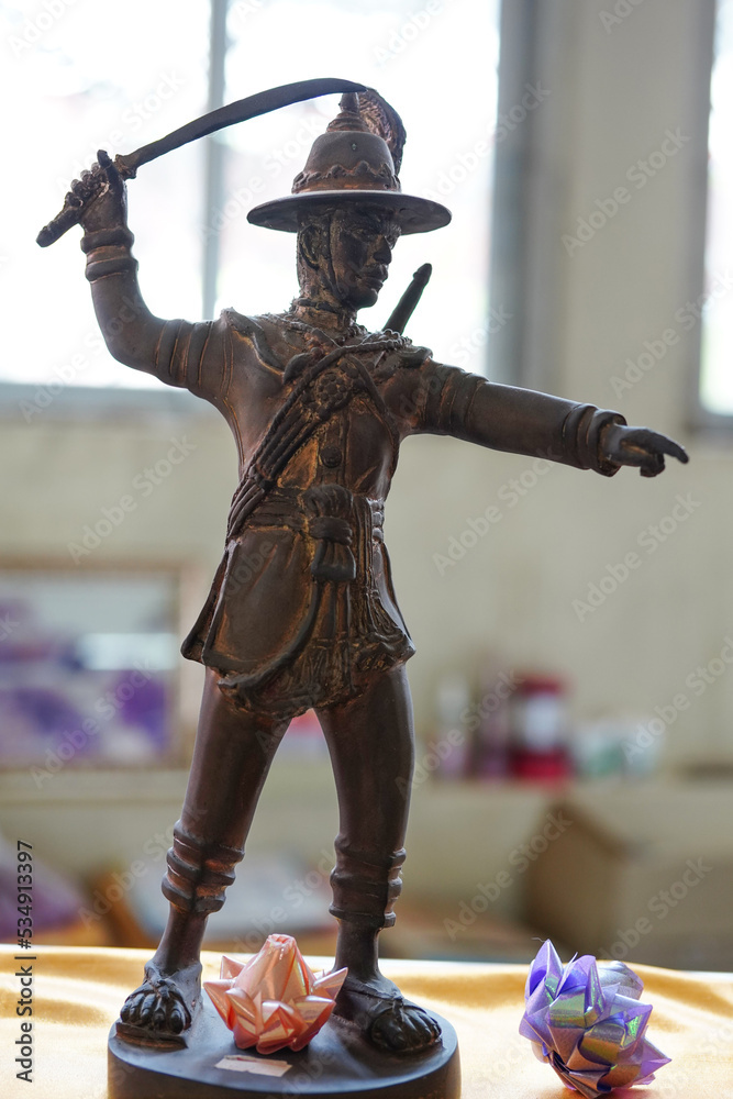 Statue of King Taksin the Great The king of Thailand is raising a ...