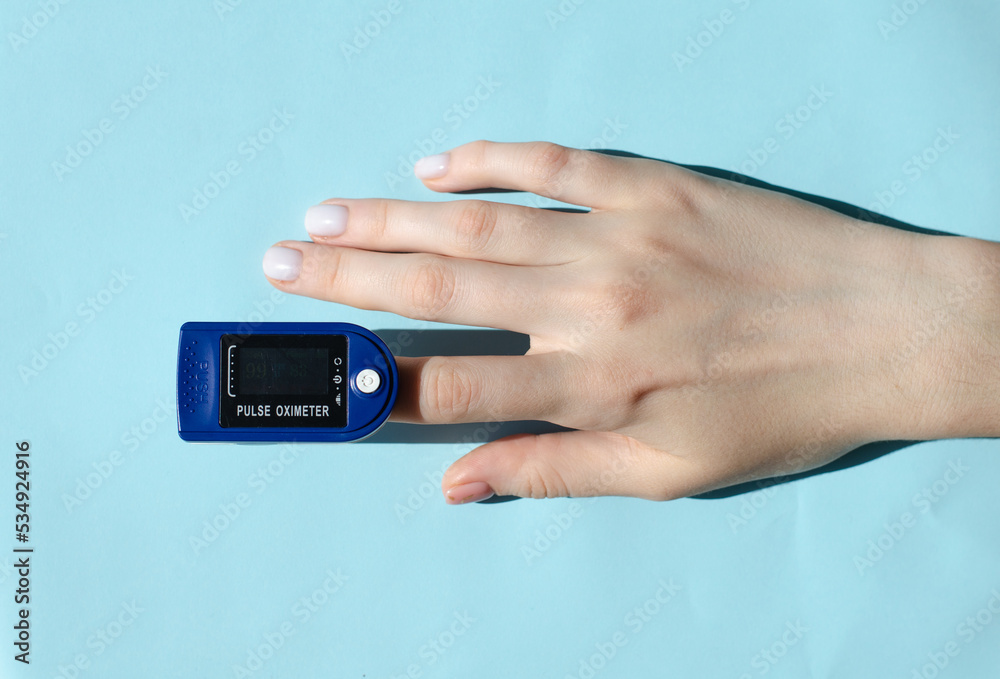 Pulse oximeter. Medical device on the finger. Patient diagnosis. Covid ...