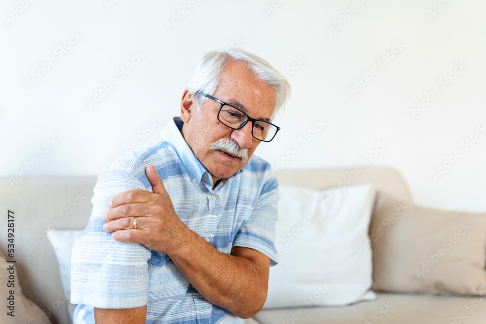 Old senior man with shoulder pain. Upset senior elder man feel sudden ...