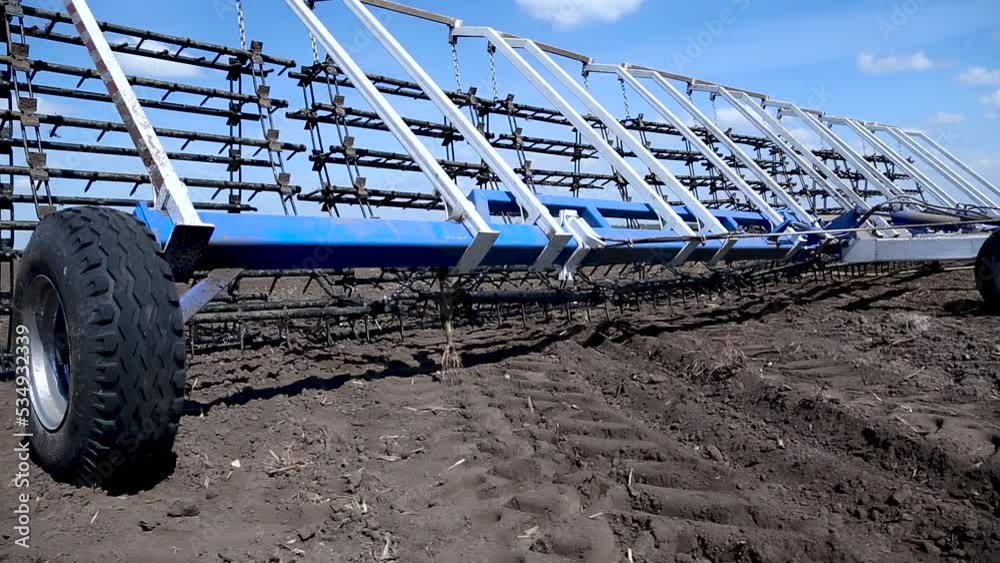 Soil cultivation. Large harrow on an agricultural field. Stock Video ...