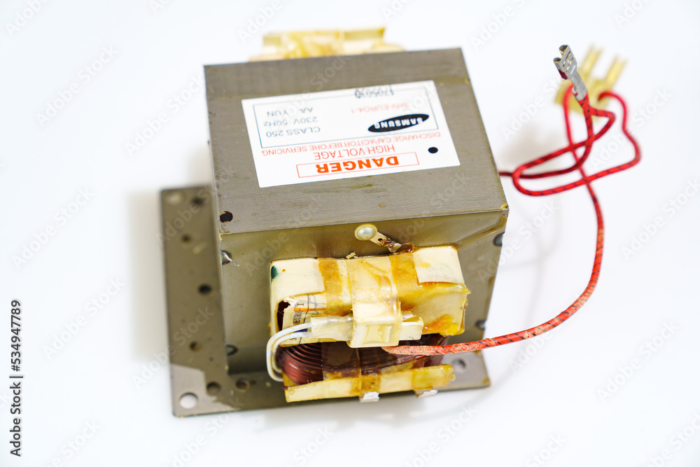High-voltage transformer for Samsung microwave oven on a white ...