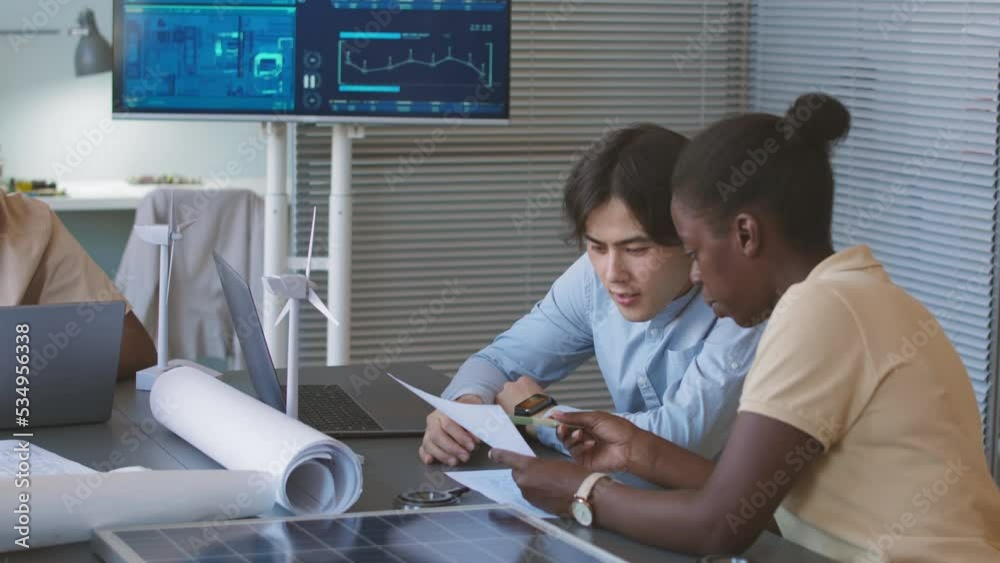 Vídeo do Stock: Two young diverse engineers having discussion on ...