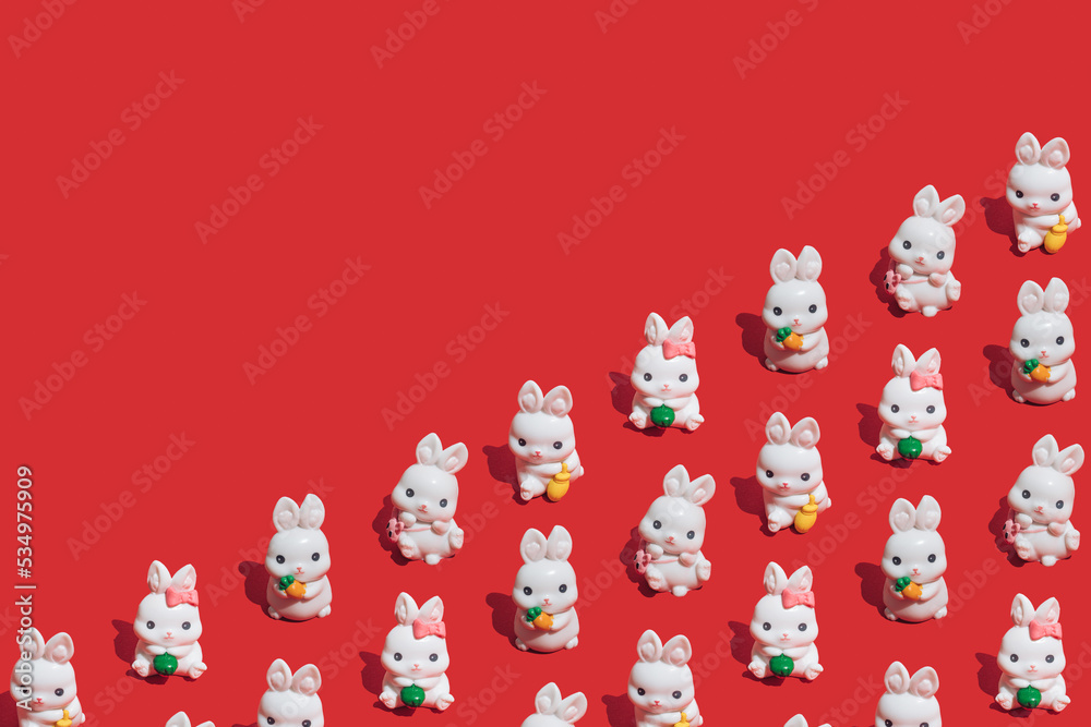 Seamless pattern made of little white rabbits on vibrant red background ...