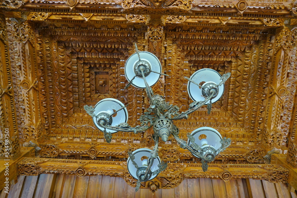 Old Javanese chandelier inside a joglo house. Javanese hanging lamp ...