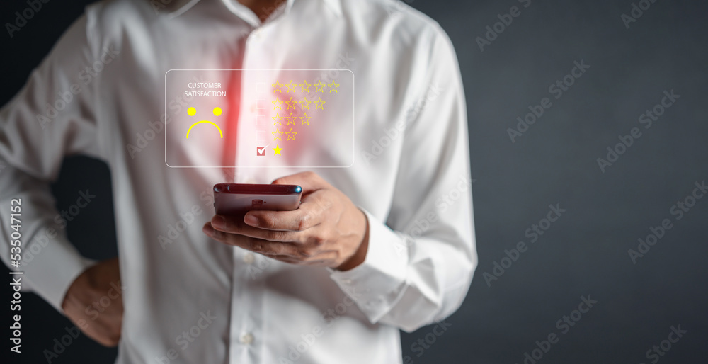 Customer Experience dissatisfied select bad face emoticon on smartphone ...