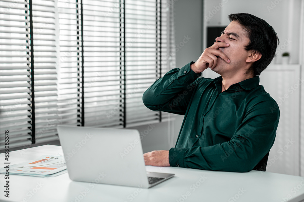 The exhausted asian office worker who was once competent is now ...