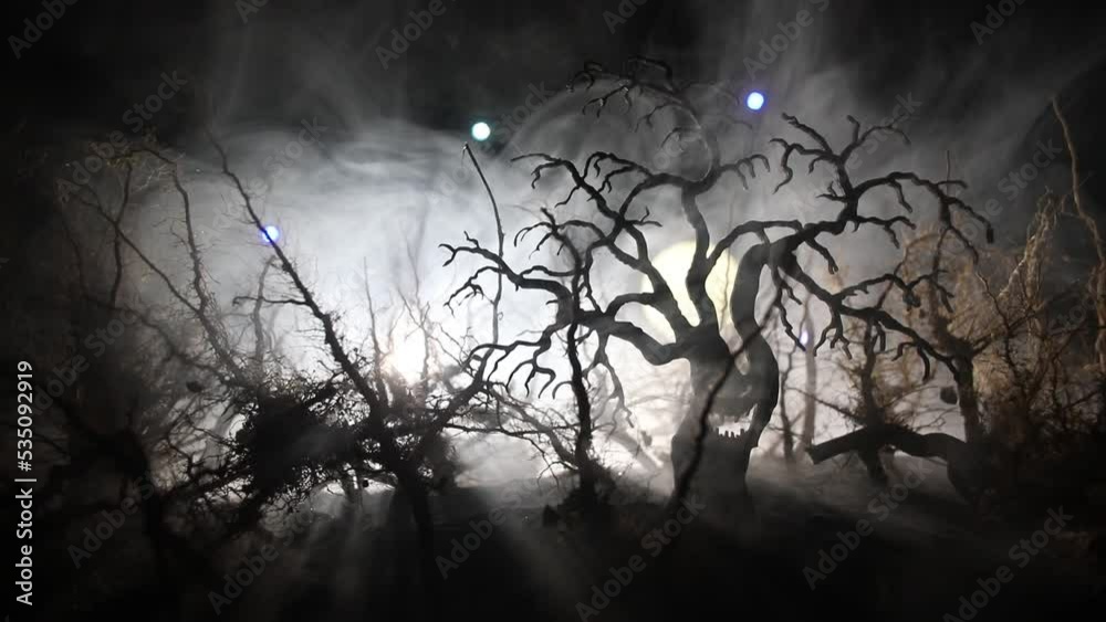 Spooky dark landscape showing silhouettes of trees in the swamp on ...