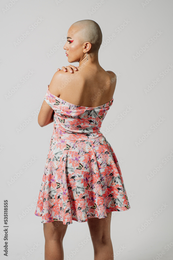 Portrait of a bald girl in a flower dress. Person breaking beauty ...
