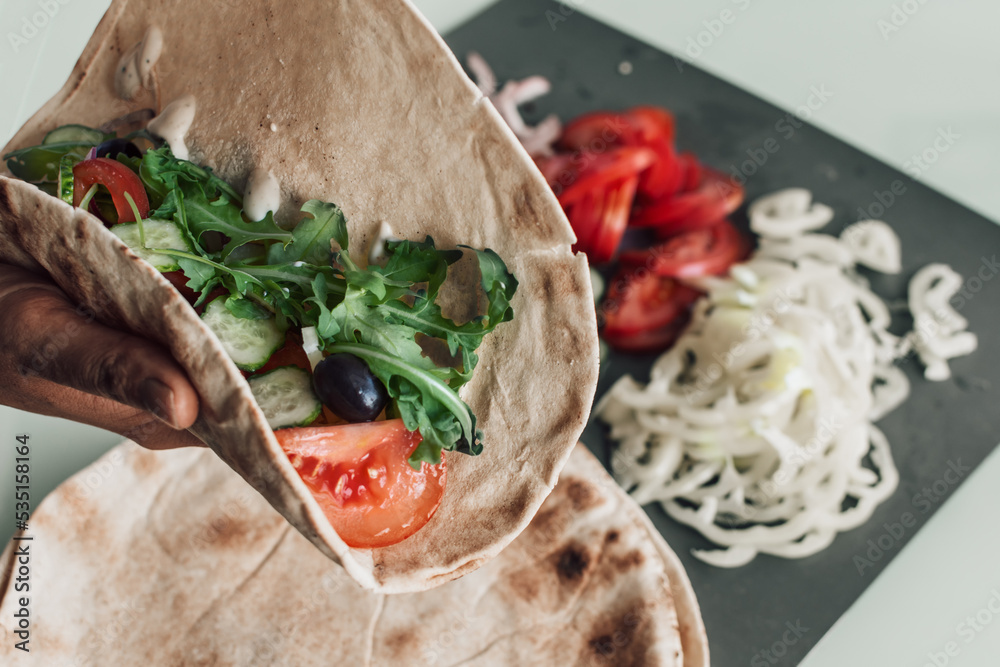 Photo & Art Print Mediterranean style pitta prepared with spicy chicken ...