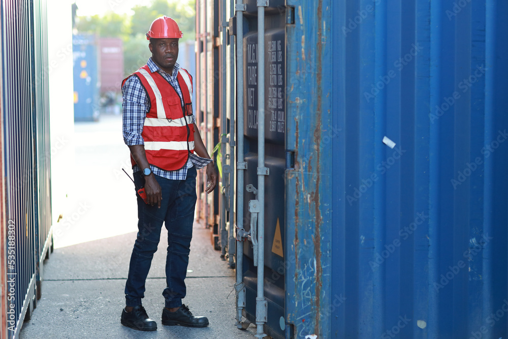 Foreman opens container door to view goods inside and control loading ...