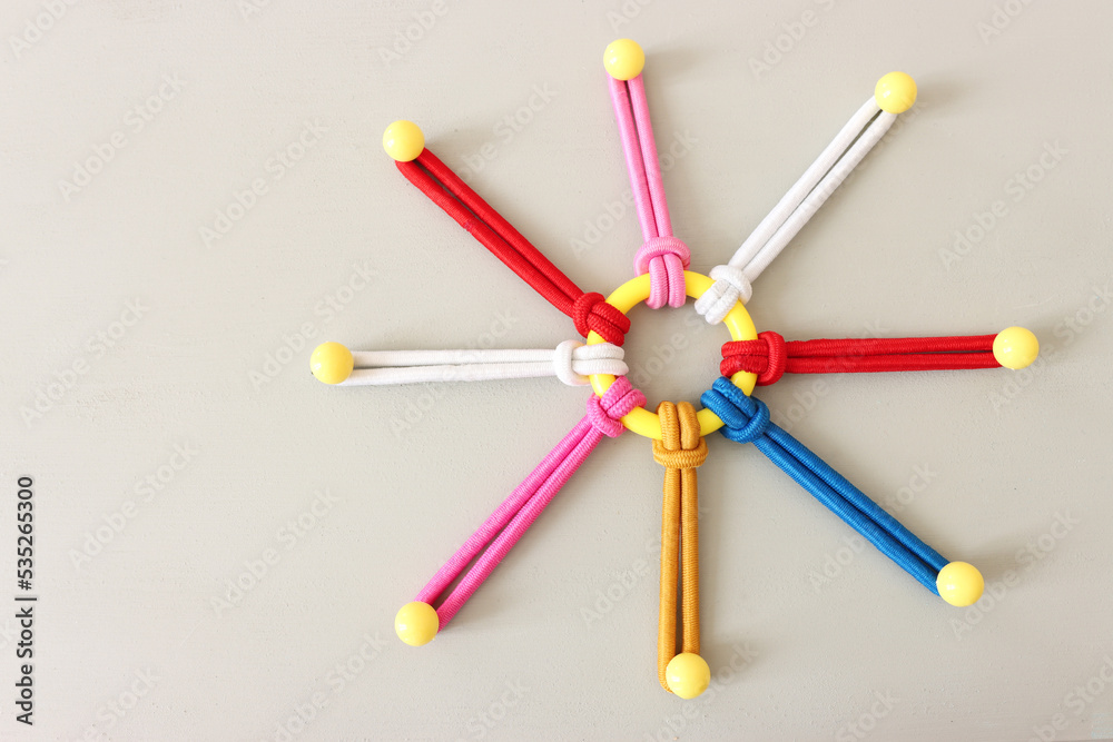 Concept image of unity and teamwork. Ropes tied together as a symbol of ...