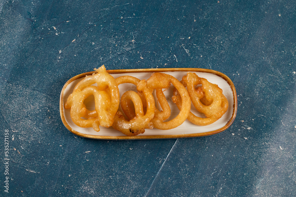 indian sweets deep fired jalebi, jilipi, jilabi served in a dish ...