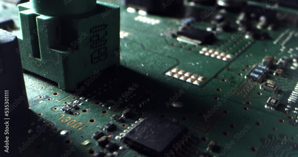 Macro Camera Moving Slowly over Printed Circuit Board, showing Computer Motherboard Components ...