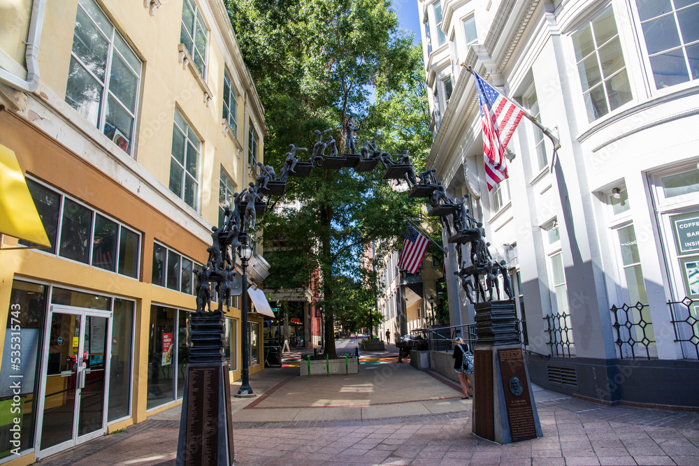 the arch of the S. Truett Cathy Monument surrounded by an American flag ...