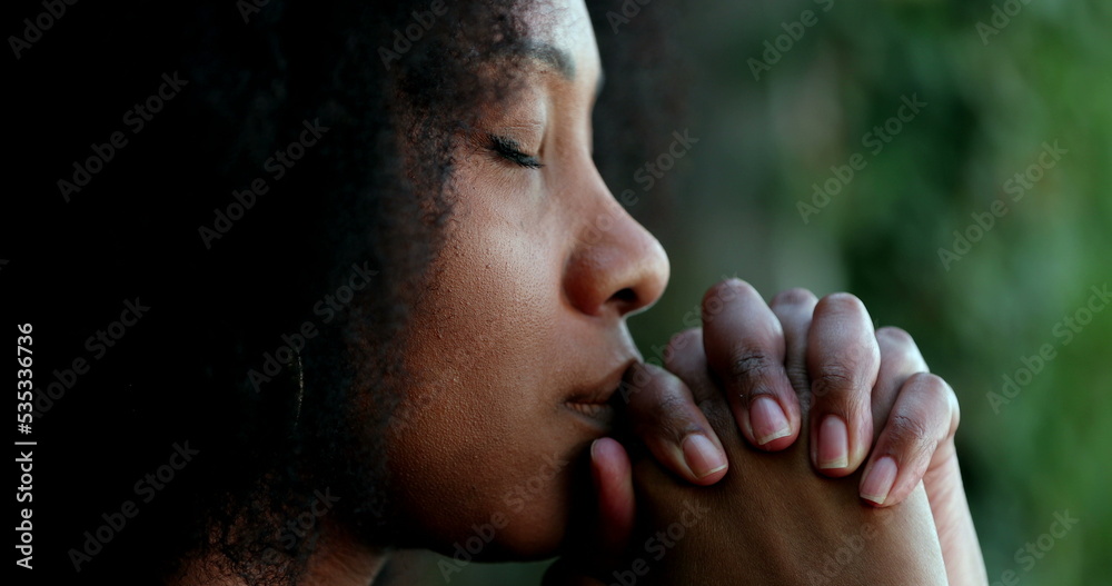 Pensive black woman praying. Thoughtful African person seeking help ...