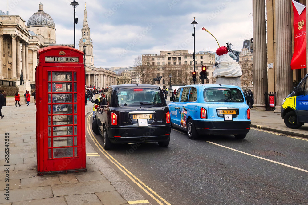 typical british red phone booth and black london taxi cab - London ...