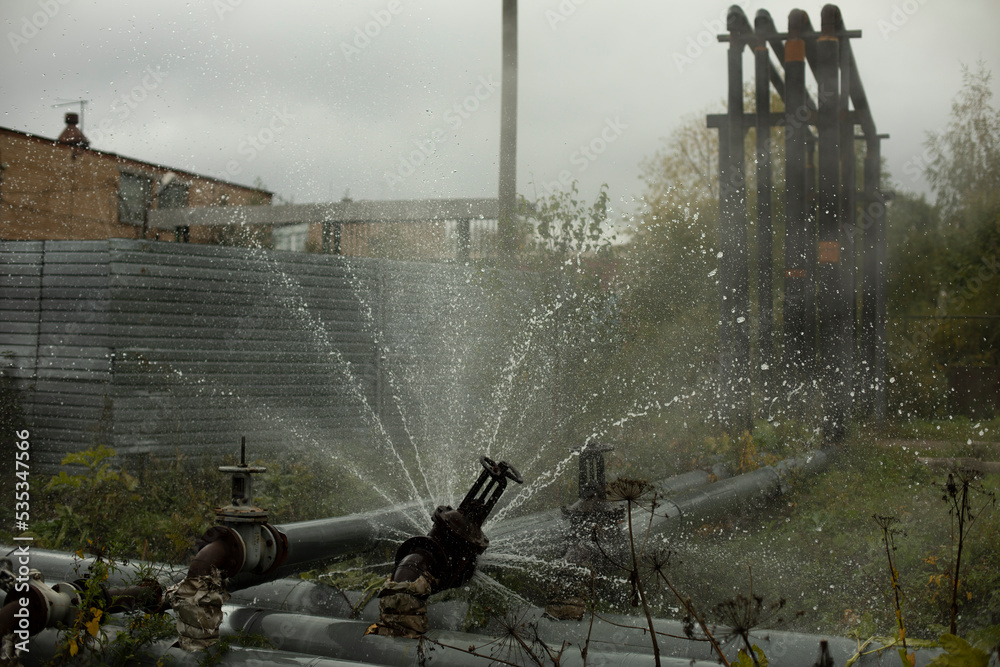 Pipe valve failure. Flow of boiling water. Steel pipe broke. Emergency ...