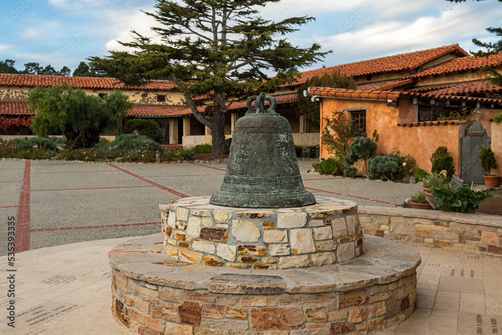 Mission bell in the courtyard, The Carmel Mission Basilica, the mission ...