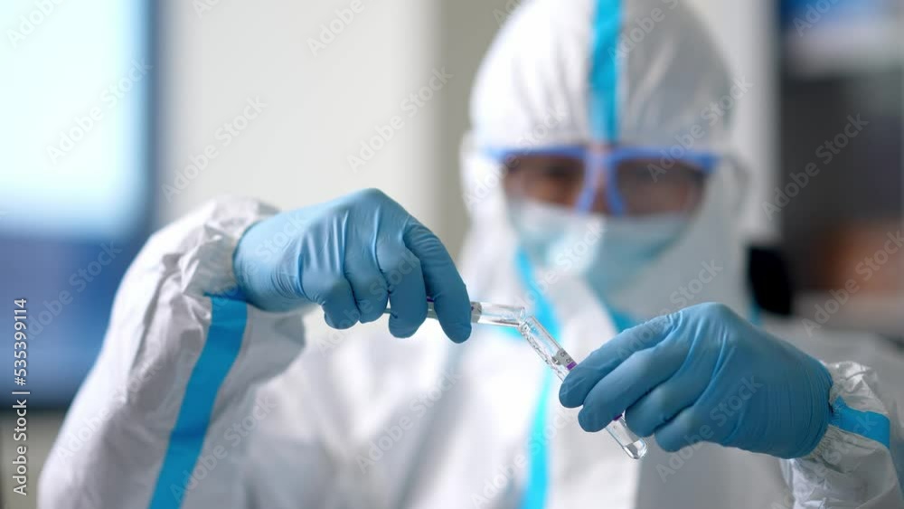 chinese man doctoro doing chemical experiment in library Stock Video ...