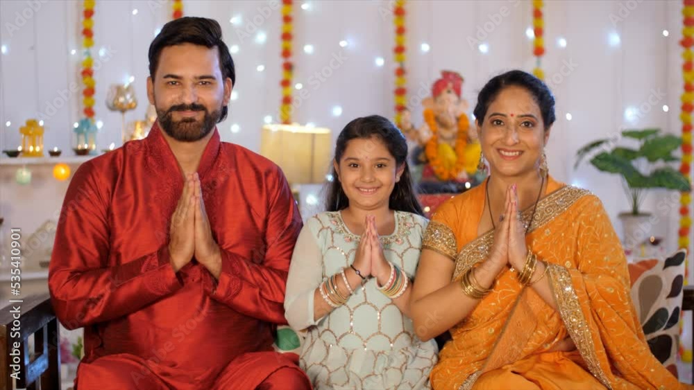 Small nuclear Indian family greeting people on Diwali - Indian culture ...