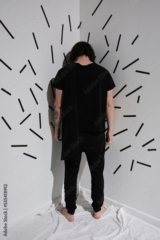 Vertical back view studio full shot of unrecognizable creepy man ...