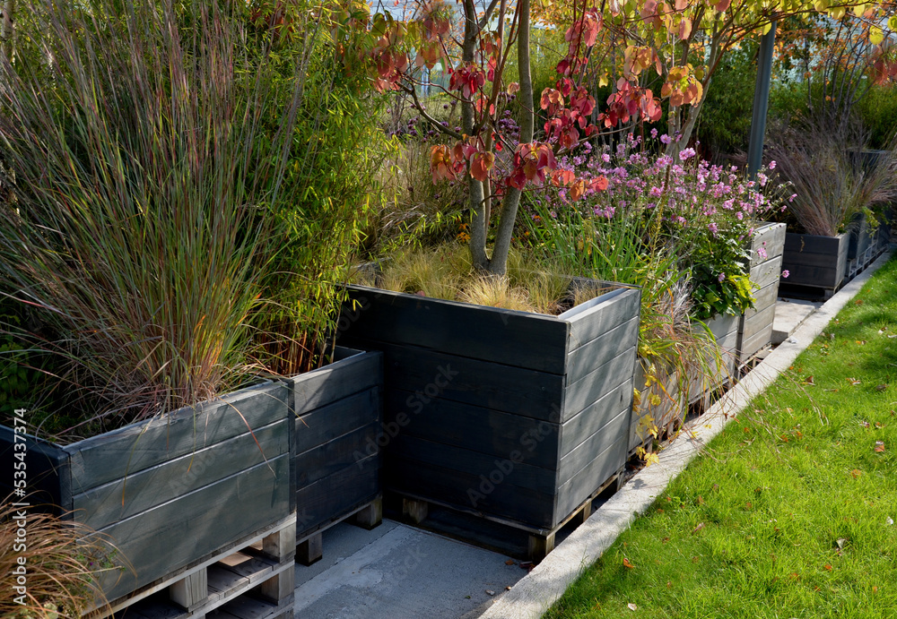 ornamental flower pots next to the road to the square. ornamental ...