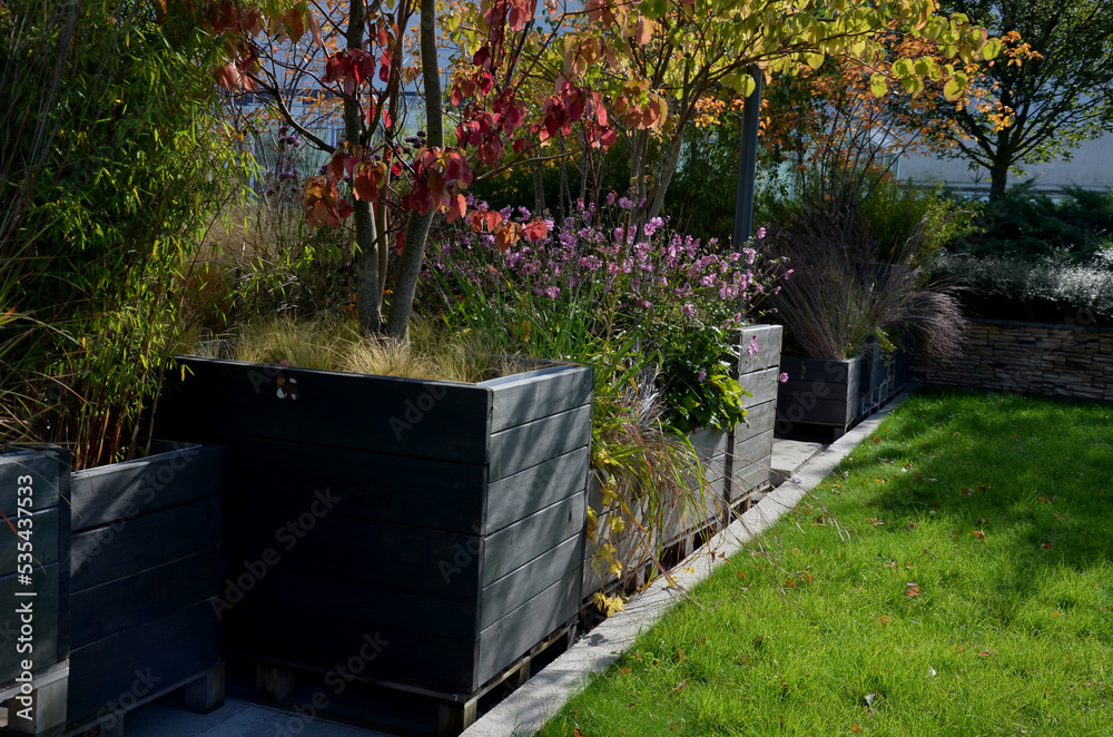 ornamental flower pots next to the road to the square. ornamental ...