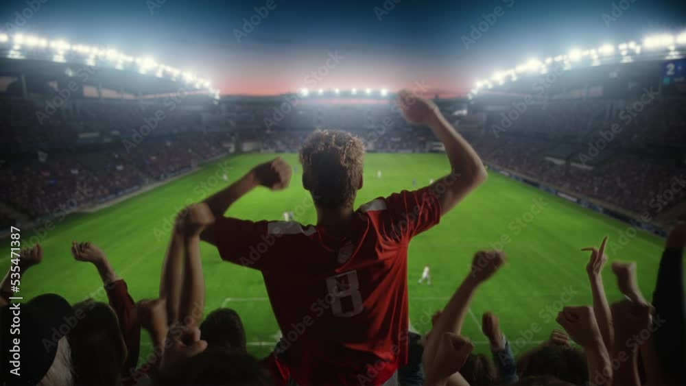 Establishing Shot of Fans Cheer for Their Team on a Stadium During ...