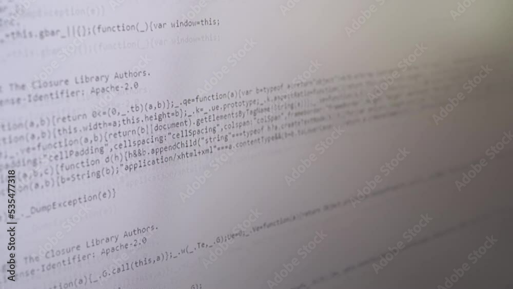 Programmer Views the HTML Code of the Page on a Screen of a Computer Monitor. Code scrolling ...