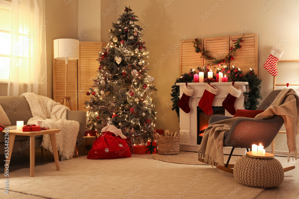 Interior of living room with Christmas tree, sofa and armchair Stock ...