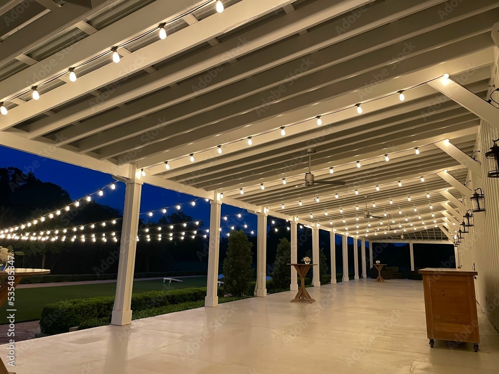 Beautiful design of empty wedding patio deck night with ceiling lamps ...