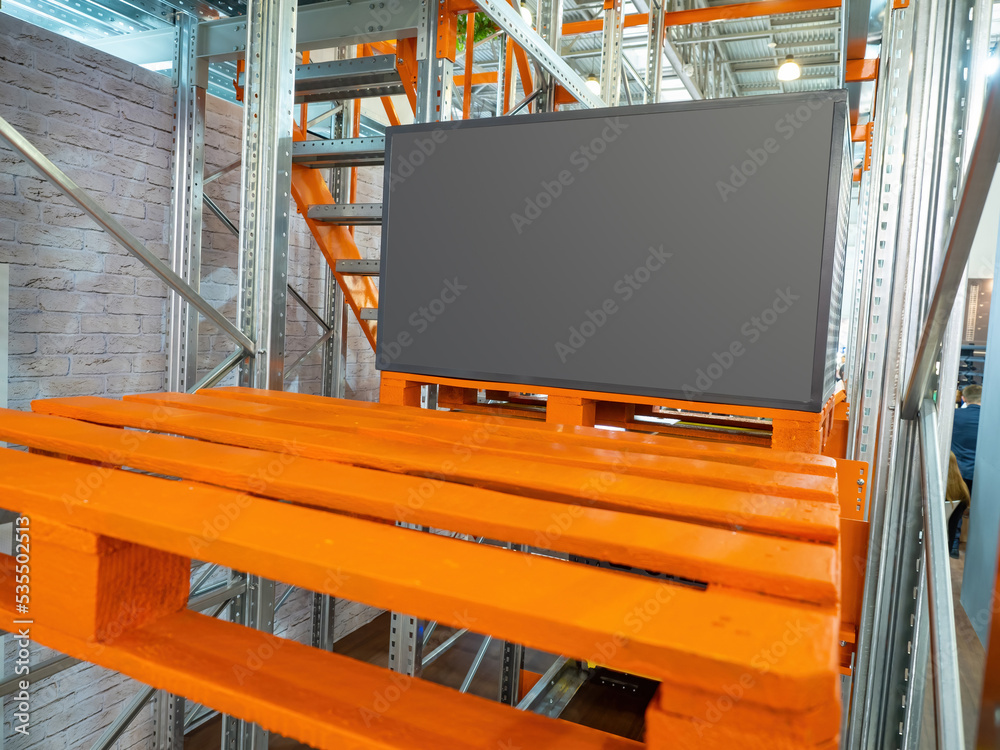 Warehouse interior. Orange wooden pallet on rack. Industrial mezzanine ...