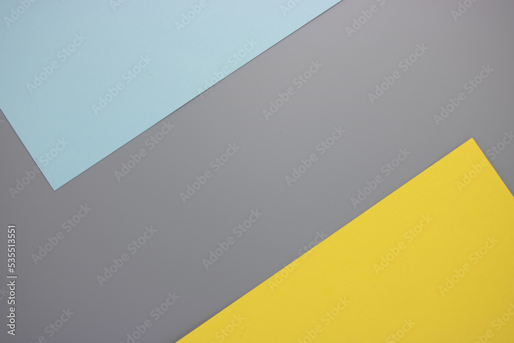 Flat lay. Top view blank yellow, blue and gray paper background, design ...