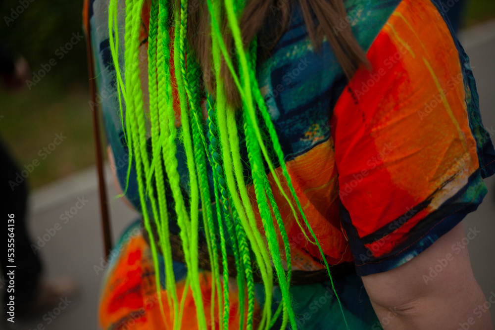 Green hair. Artificial hair is green. Bright dreadlocks. Stock Photo ...