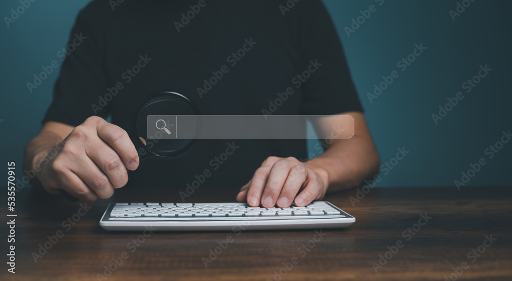 Magnifying glass keyboard computer and search bar or search box on ...